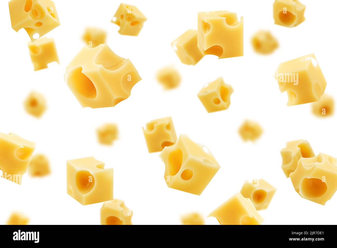 Falling cheese cube, isolated on white background, selective focus ...