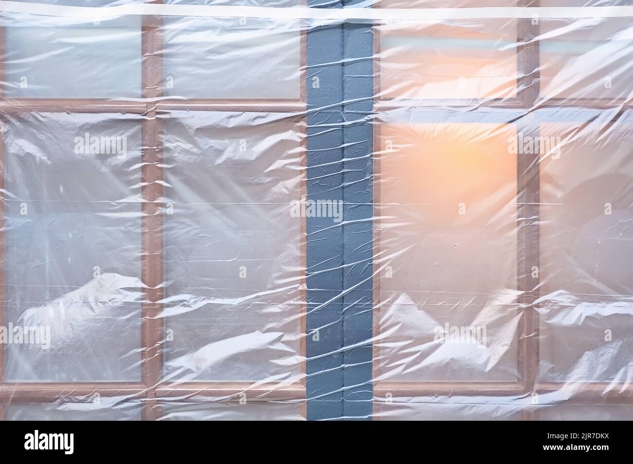Window covered with plastic film Stock Photo - Alamy