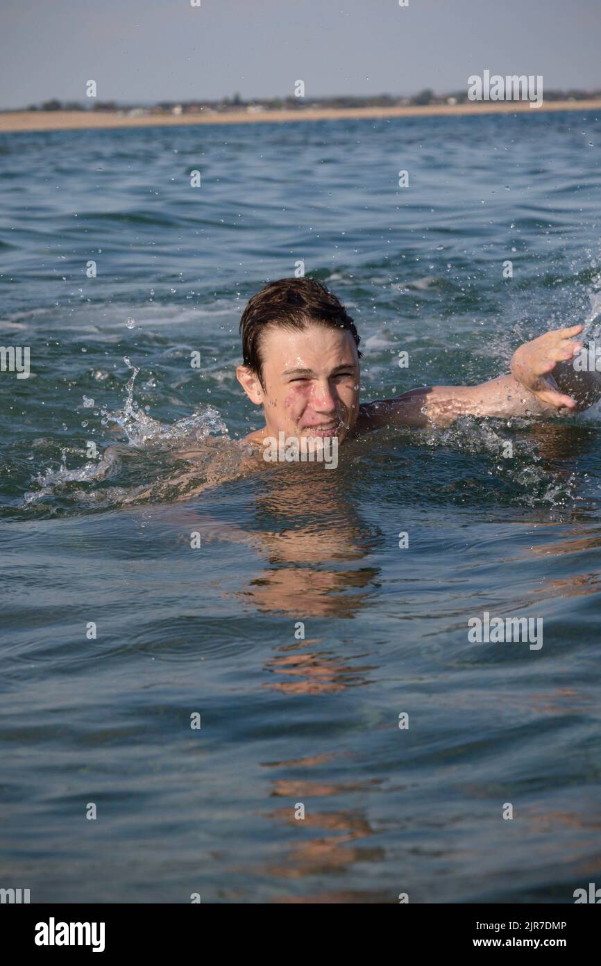 A 17 Year Old Teenage Boy Swimming In The Sea Stock Photo - Alamy