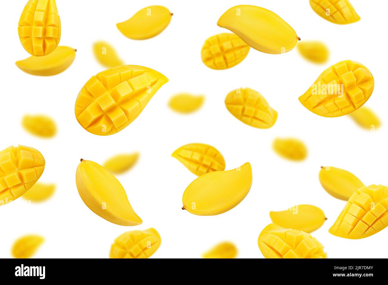 Falling yellow mango isolated on white background, selective focus ...