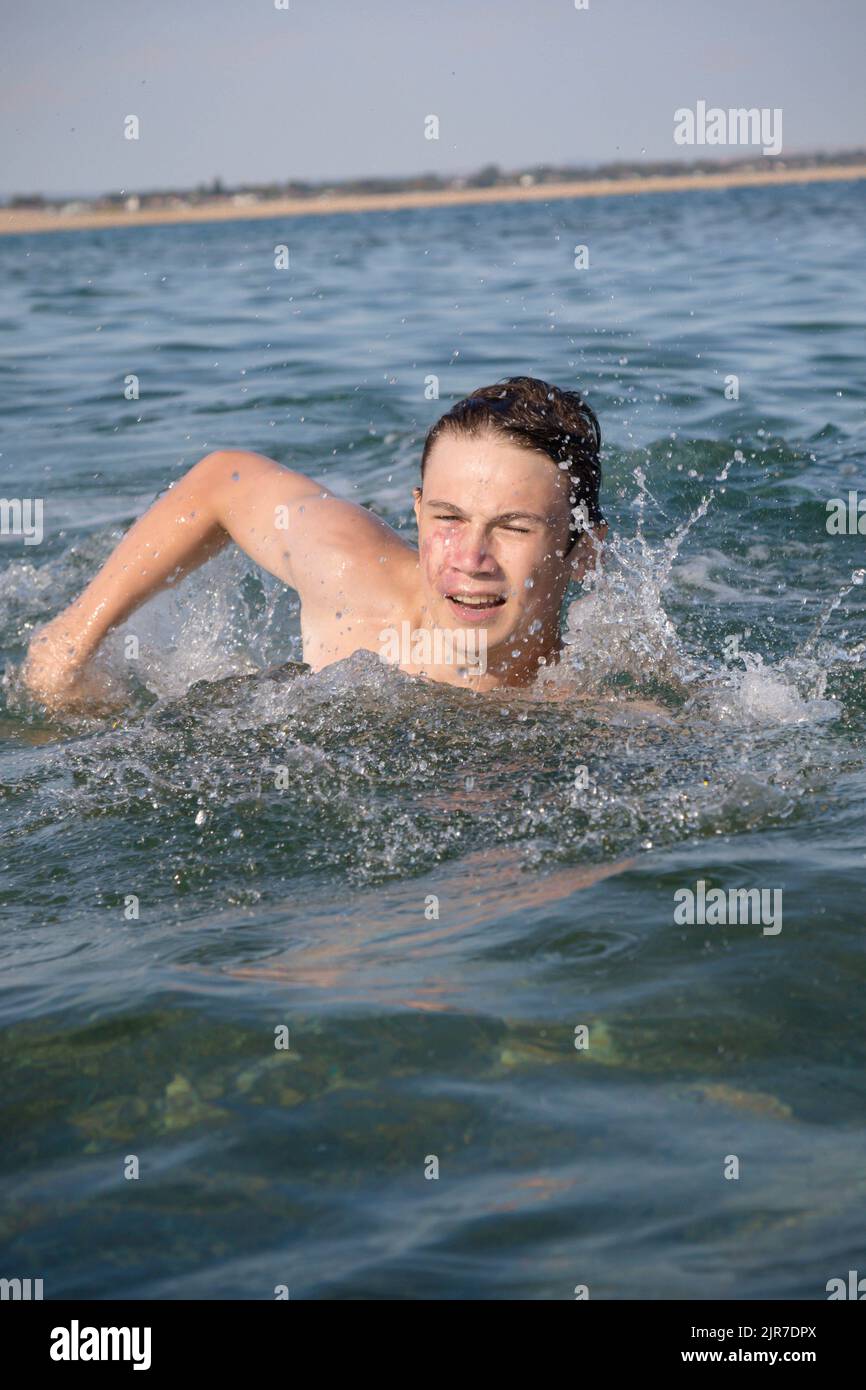 A 17 Year Old Teenage Boy Swimming In The Sea Stock Photo - Alamy