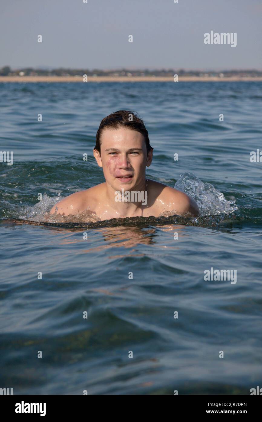 A 17 Year Old Teenage Boy Swimming In The Sea Stock Photo - Alamy