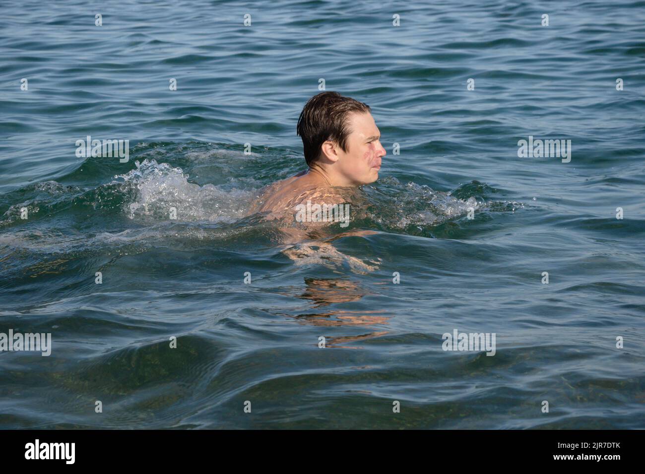 A 17 Year Old Teenage Boy Swimming In The Sea Stock Photo - Alamy