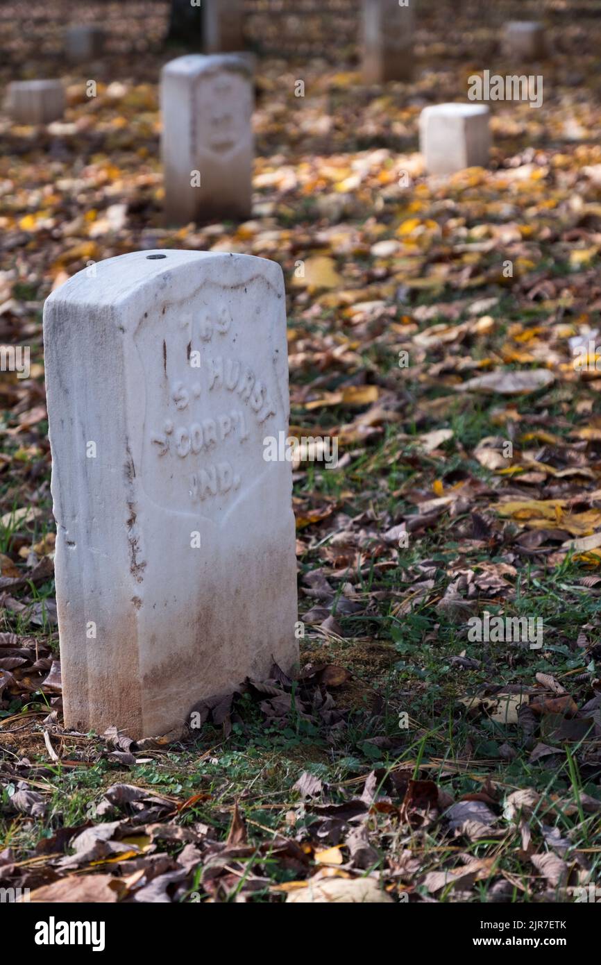 A vertical shot of Confederate grave headstones in the Stones River ...