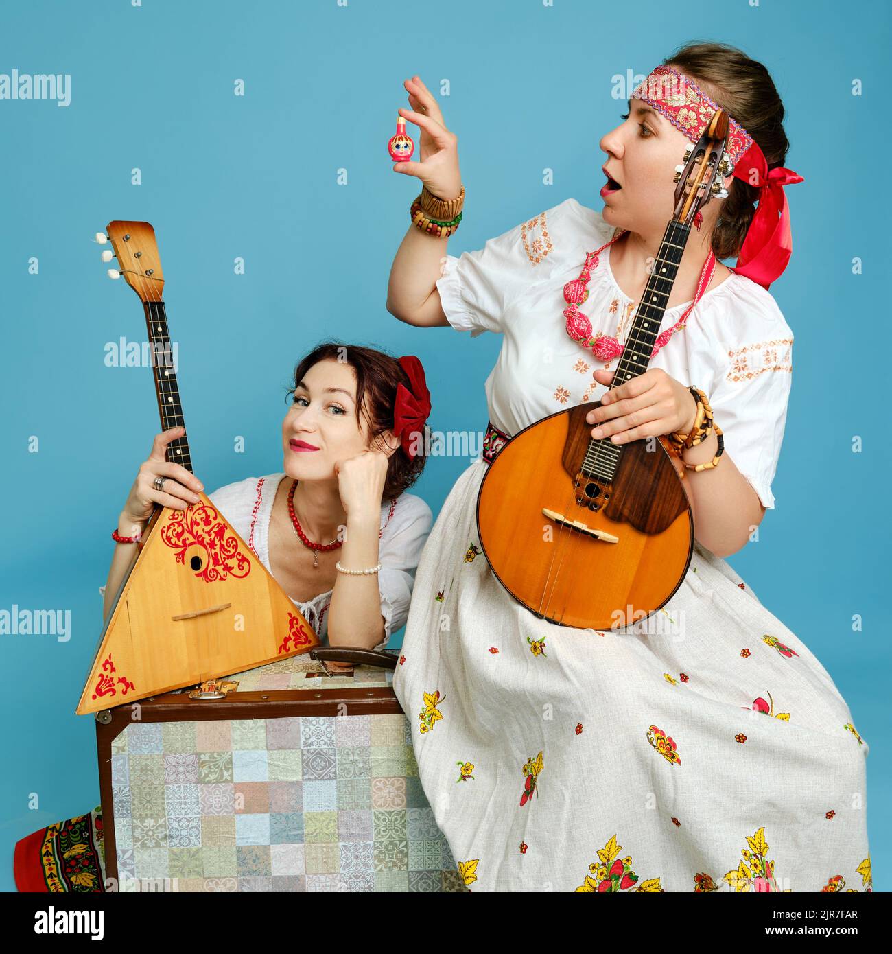 Women musicians in Russian folk dresses with musical instruments on a ...