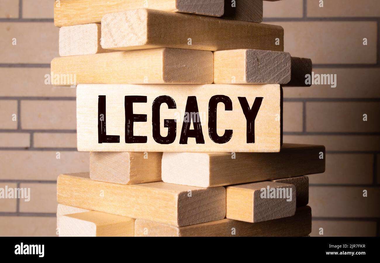 LEGACY concept, wooden word block on grey background Stock Photo - Alamy