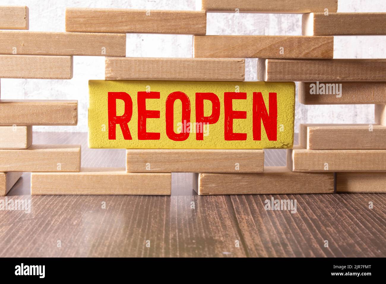 torn paper revealing the word REOPENING on white background Stock Photo ...