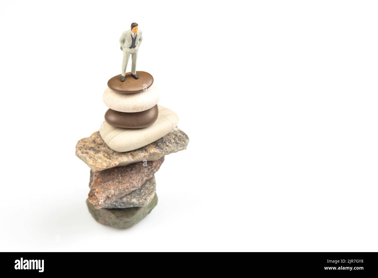 Miniature man on stones hi-res stock photography and images - Alamy
