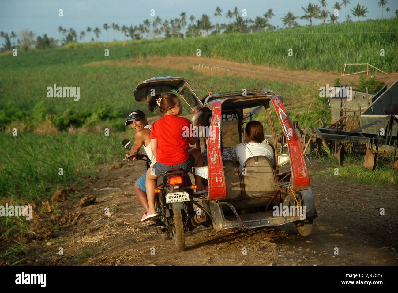 Trike carrying passengers, Sugar Cane Farm, Cadiz City, Negros ...