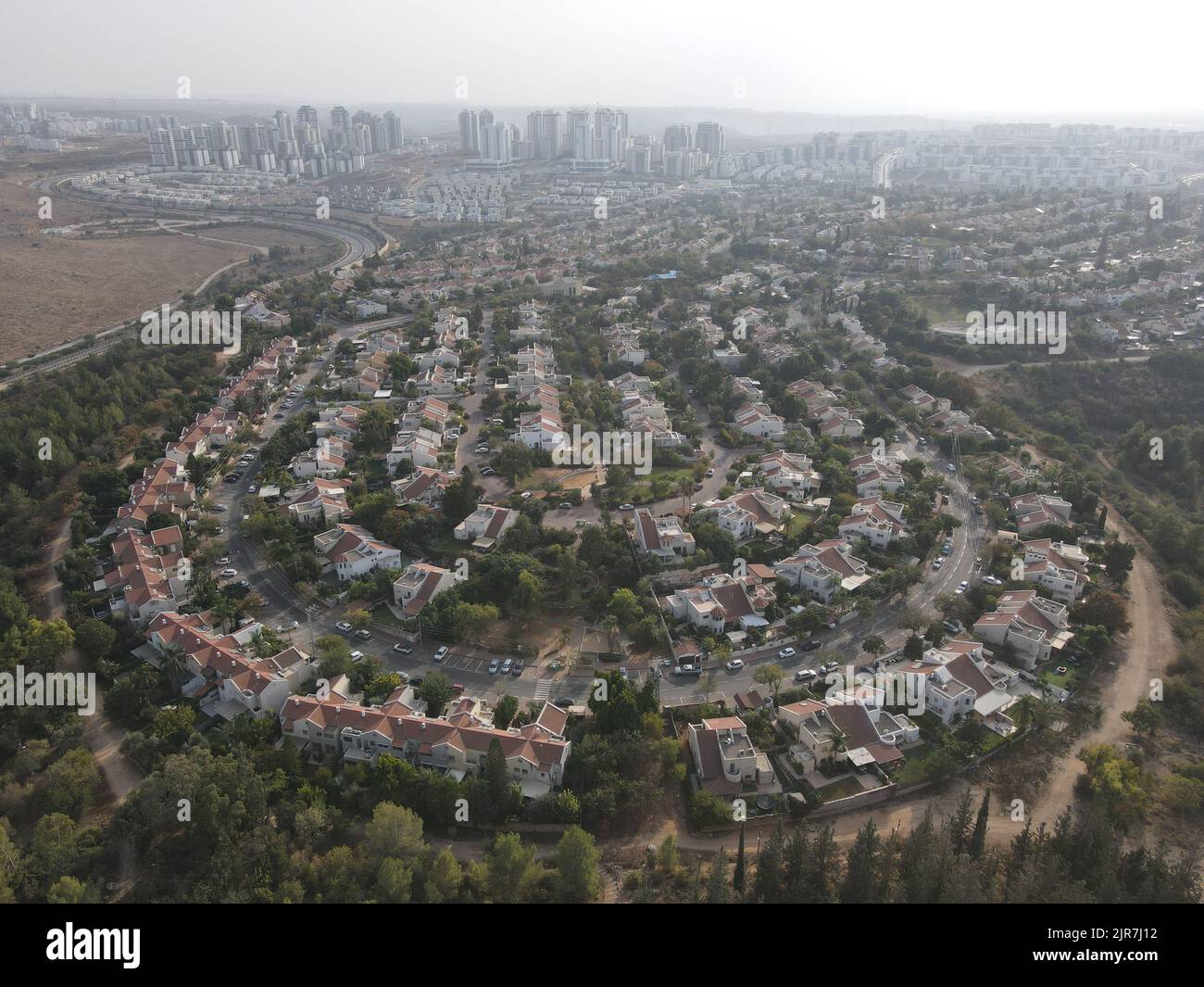 An aerial view of an organized city design with buildings and green ...