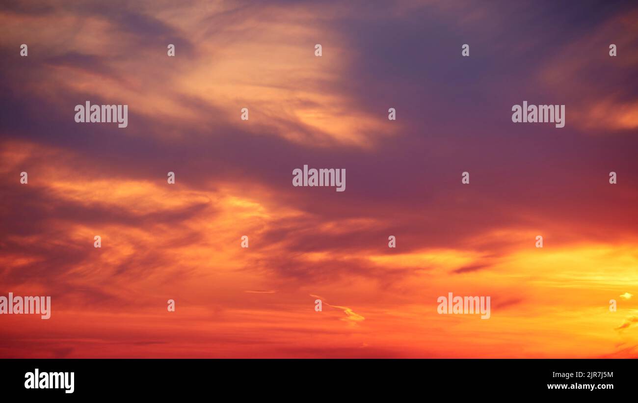 Evening sky with setting sun through clouds at sunset, cloudy landscape ...