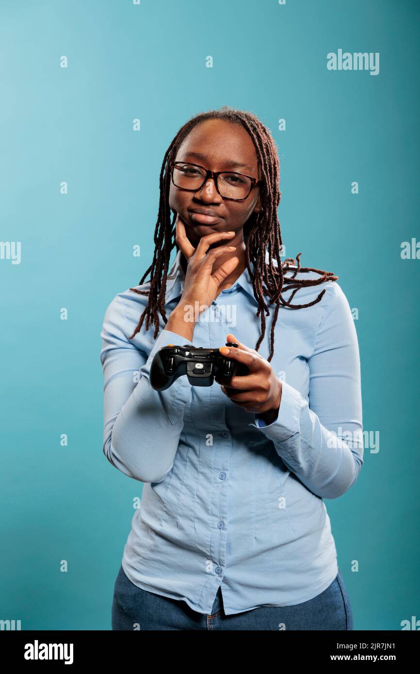 Sad adult gamer with videogame console modern controller losing online ...