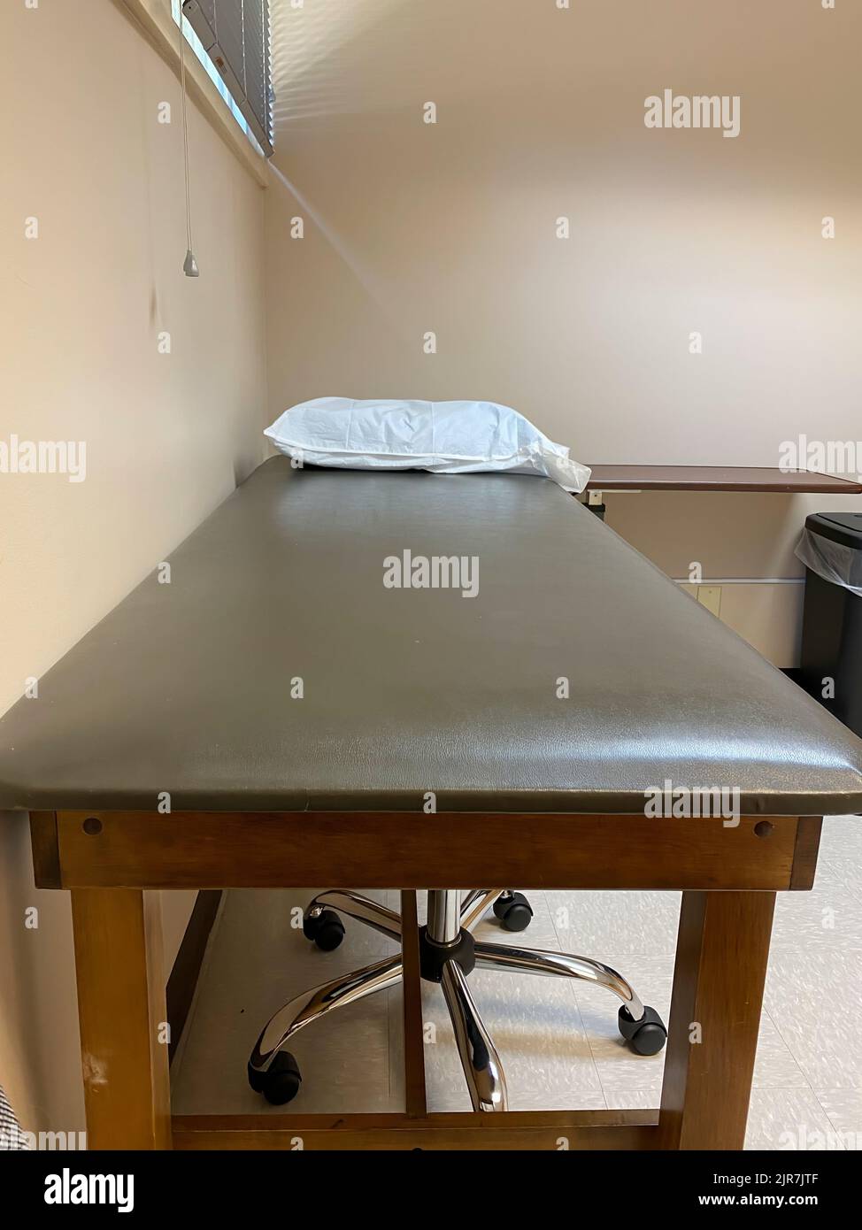 Wooden exam table to local orthopedic surgeon's office Stock Photo - Alamy