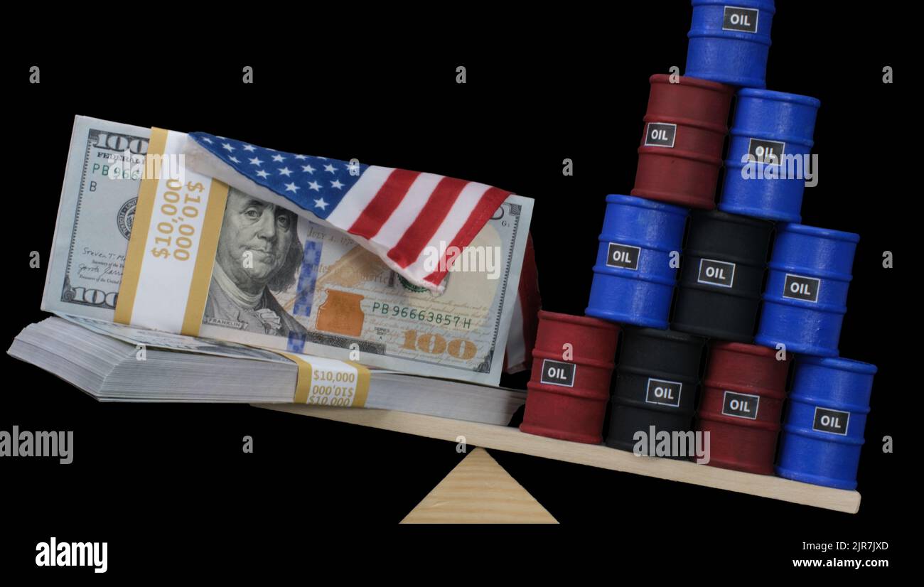 US dollar on balance scale with oil barrels Stock Photo - Alamy