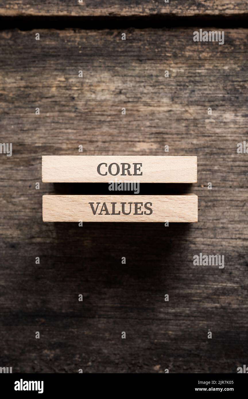 Core values sign written on two stacked wooden pegs placed on rustic ...