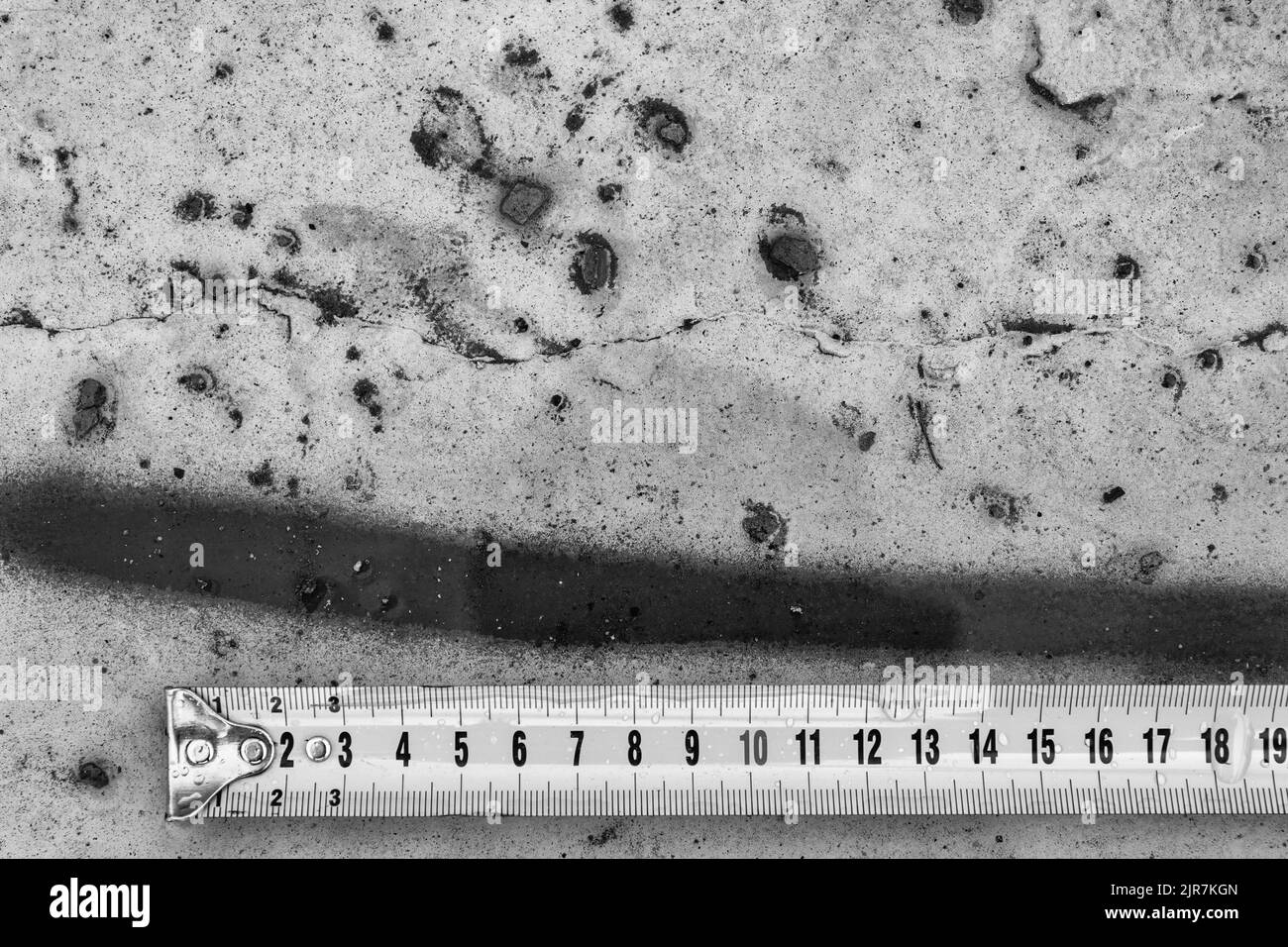 Measuring ruler on a concrete wall texture. The concept of renovation ...