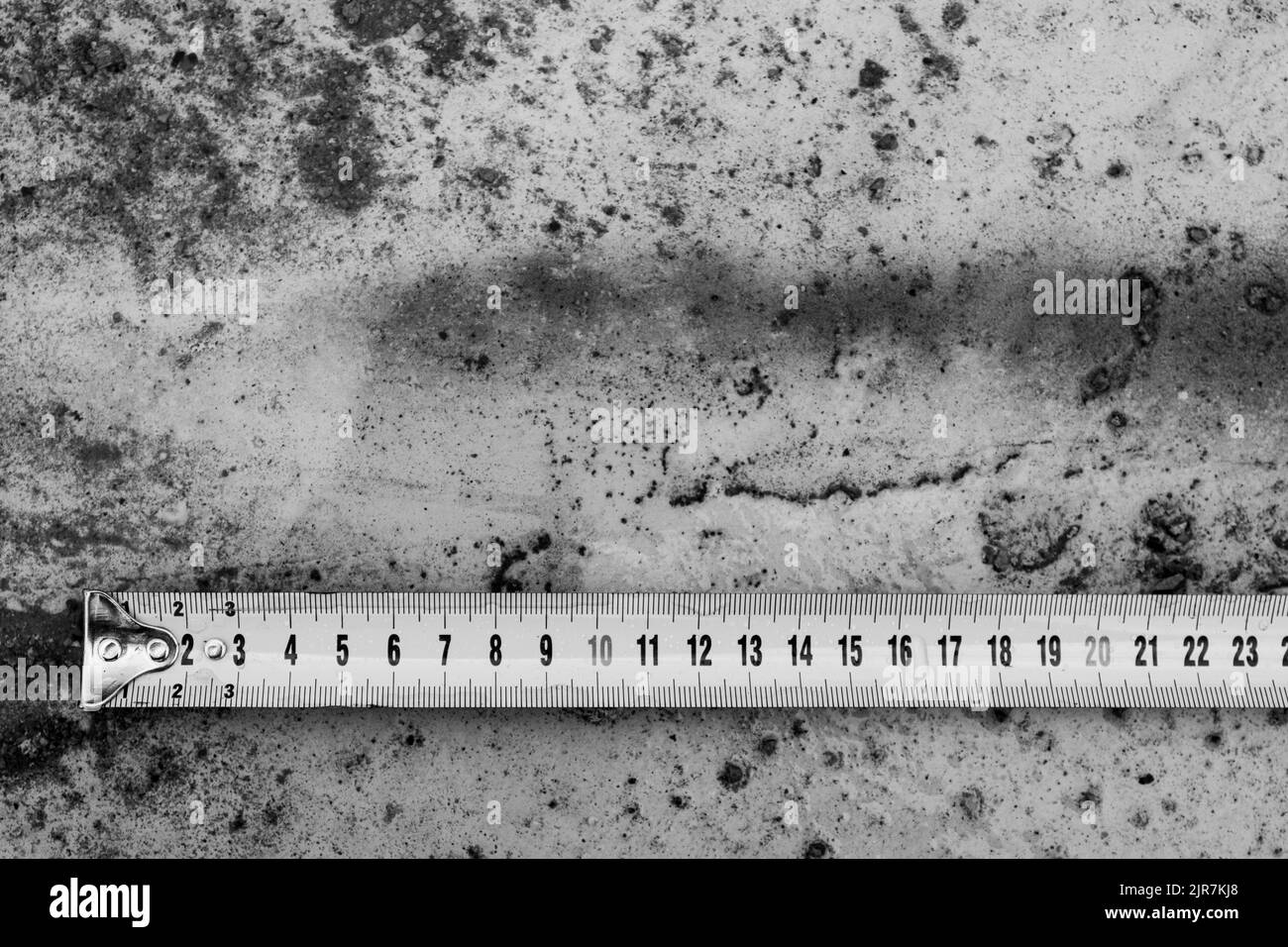 Measuring ruler on a concrete wall texture. The concept of renovation ...