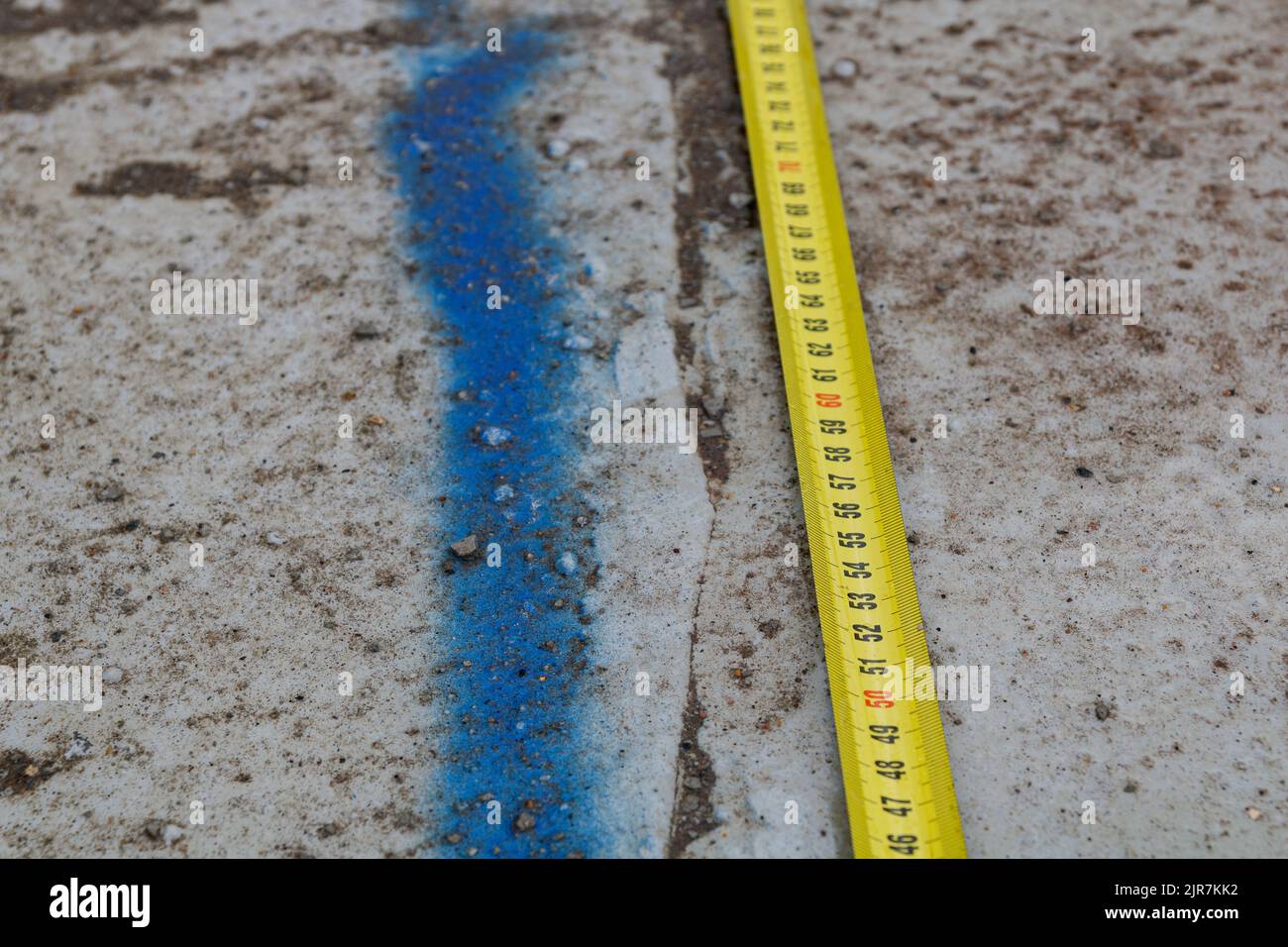 Measuring ruler on a concrete wall texture. The concept of renovation ...