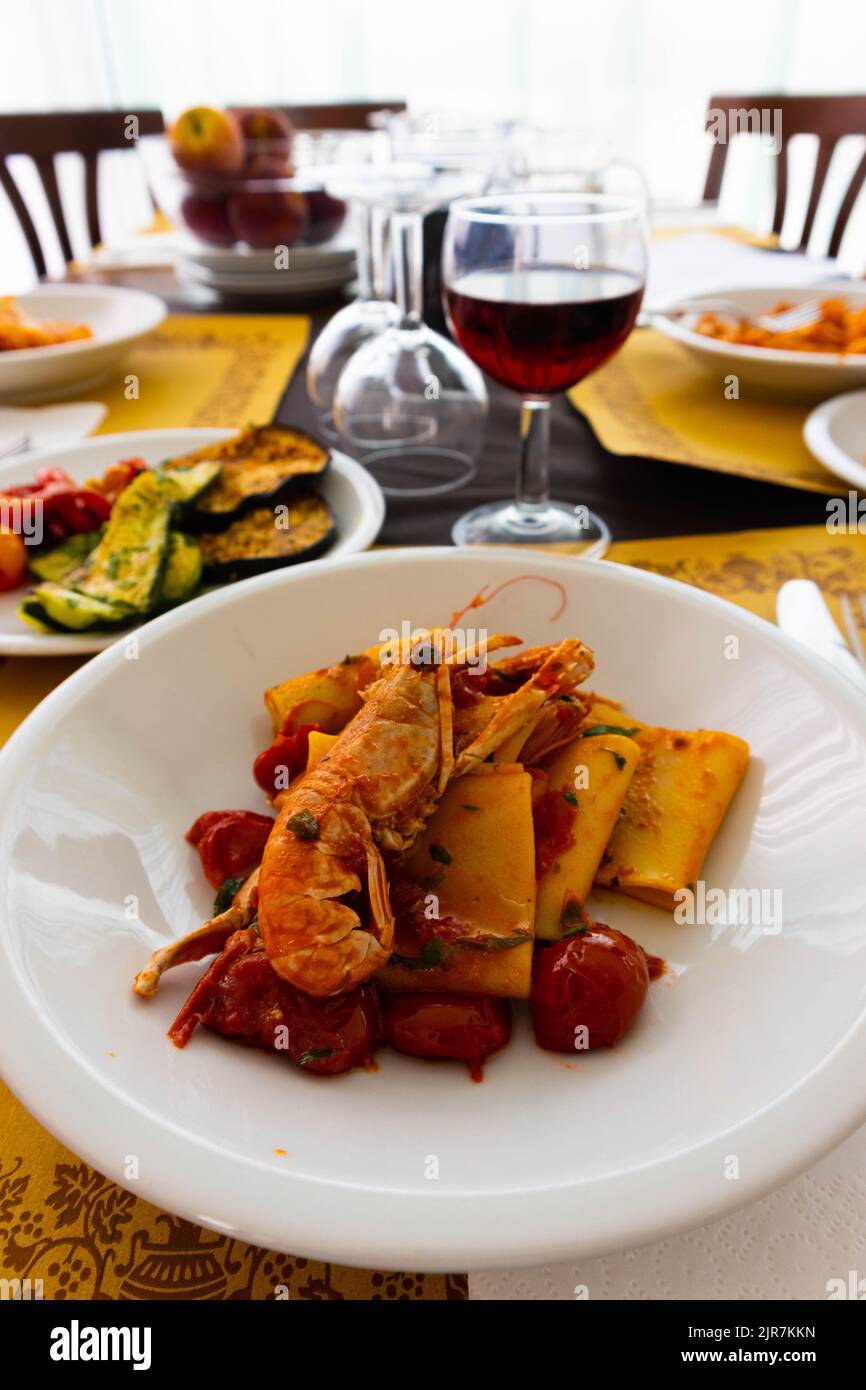 Cannelloni with red shrimp sauce and wine, Rimini, Italy. High quality ...