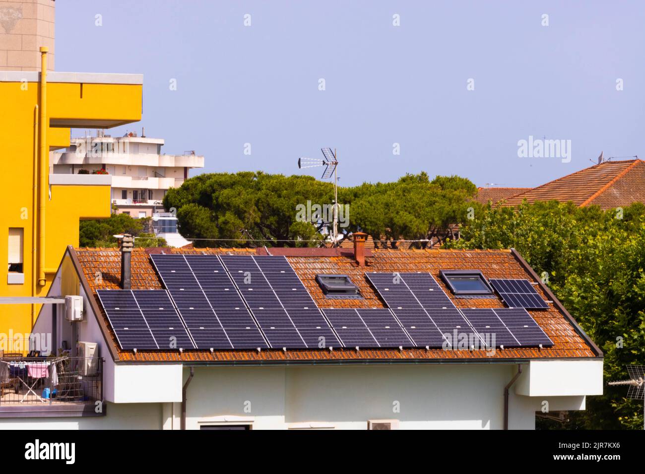 Solar panels on pitched tiled roof, Rimini, Italy Stock Photo - Alamy