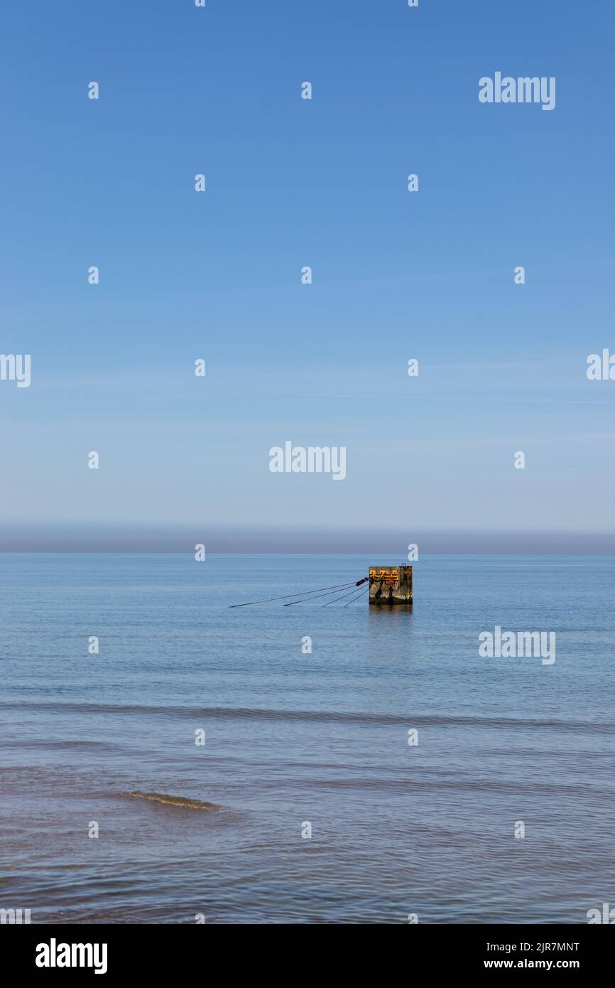 Concrete block with metal ropes in the sea Stock Photo - Alamy