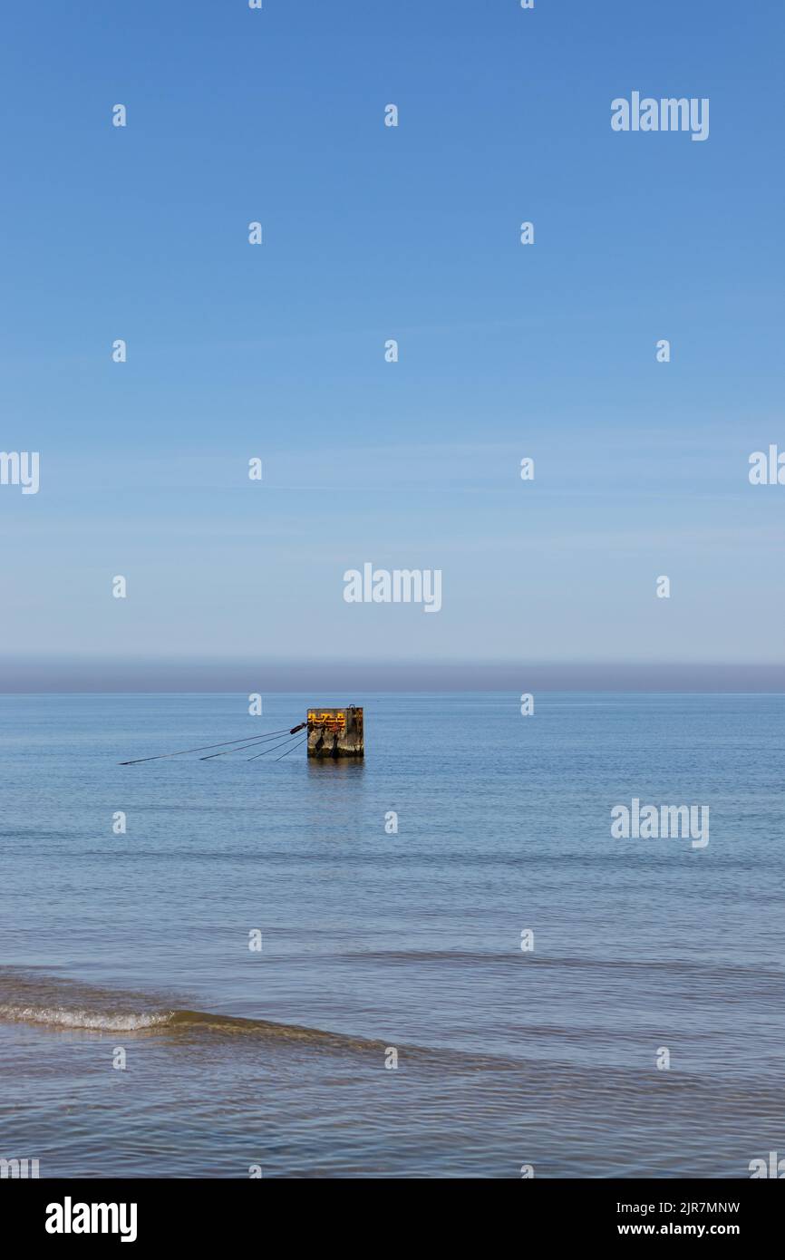 Concrete block with metal ropes in the sea Stock Photo - Alamy