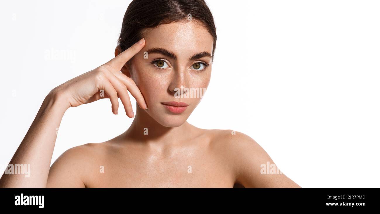 Beautiful skin healthy woman face with manicure nails hand touching ...