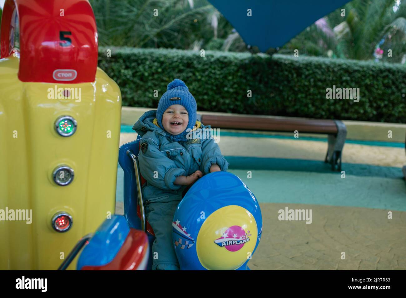 Child portrait playground happy ride hi-res stock photography and ...