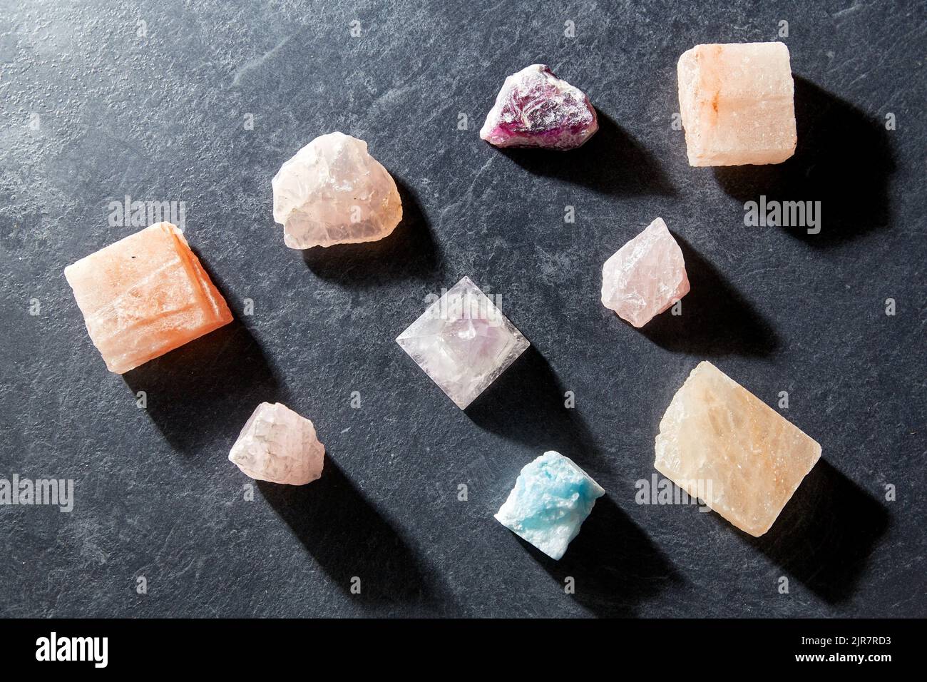 quartz crystal pyramid and gem stones on slate Stock Photo - Alamy