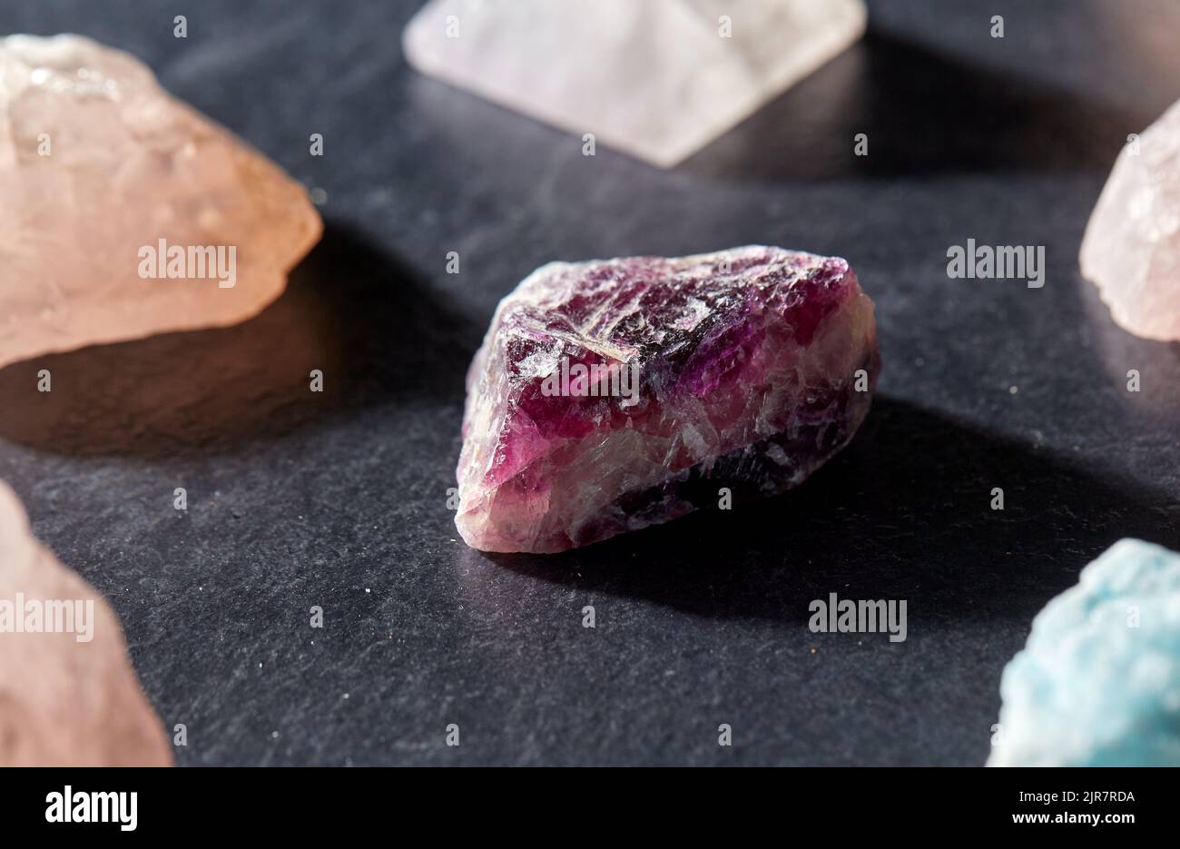 quartz crystals and gem stones on slate background Stock Photo - Alamy