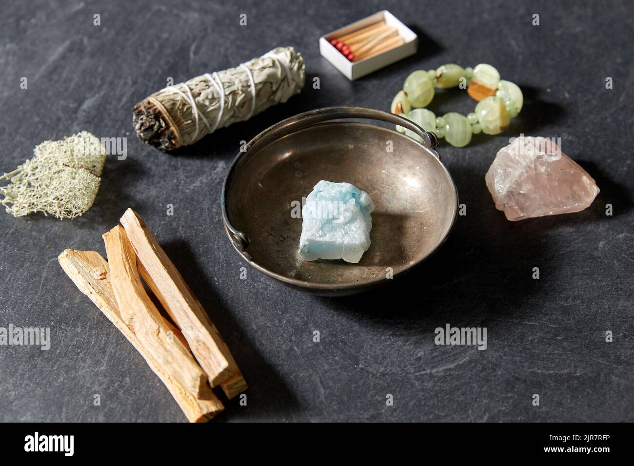 various staff for magic ritual on slate background Stock Photo - Alamy