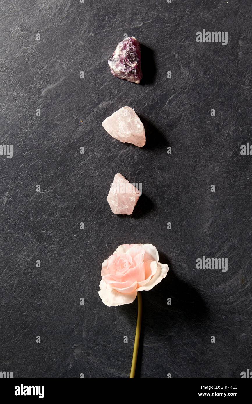 quartz crystals, gem stones and rose flower Stock Photo - Alamy