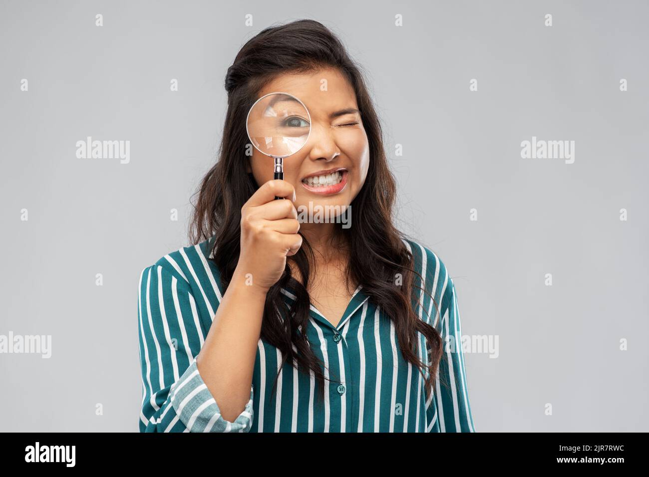 Woman with magnifying lens hi-res stock photography and images - Alamy