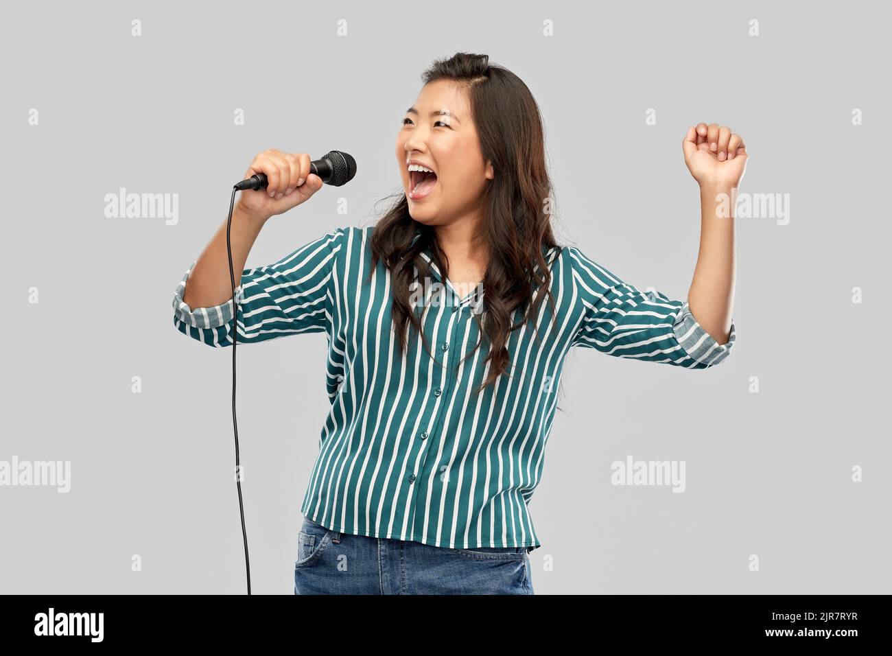 Joyful singing young woman hi-res stock photography and images - Alamy