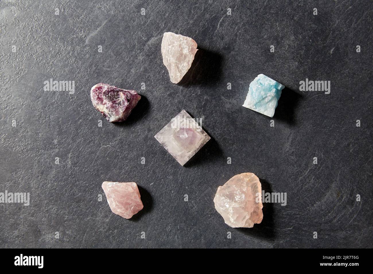 quartz crystal pyramid and gem stones on slate Stock Photo - Alamy