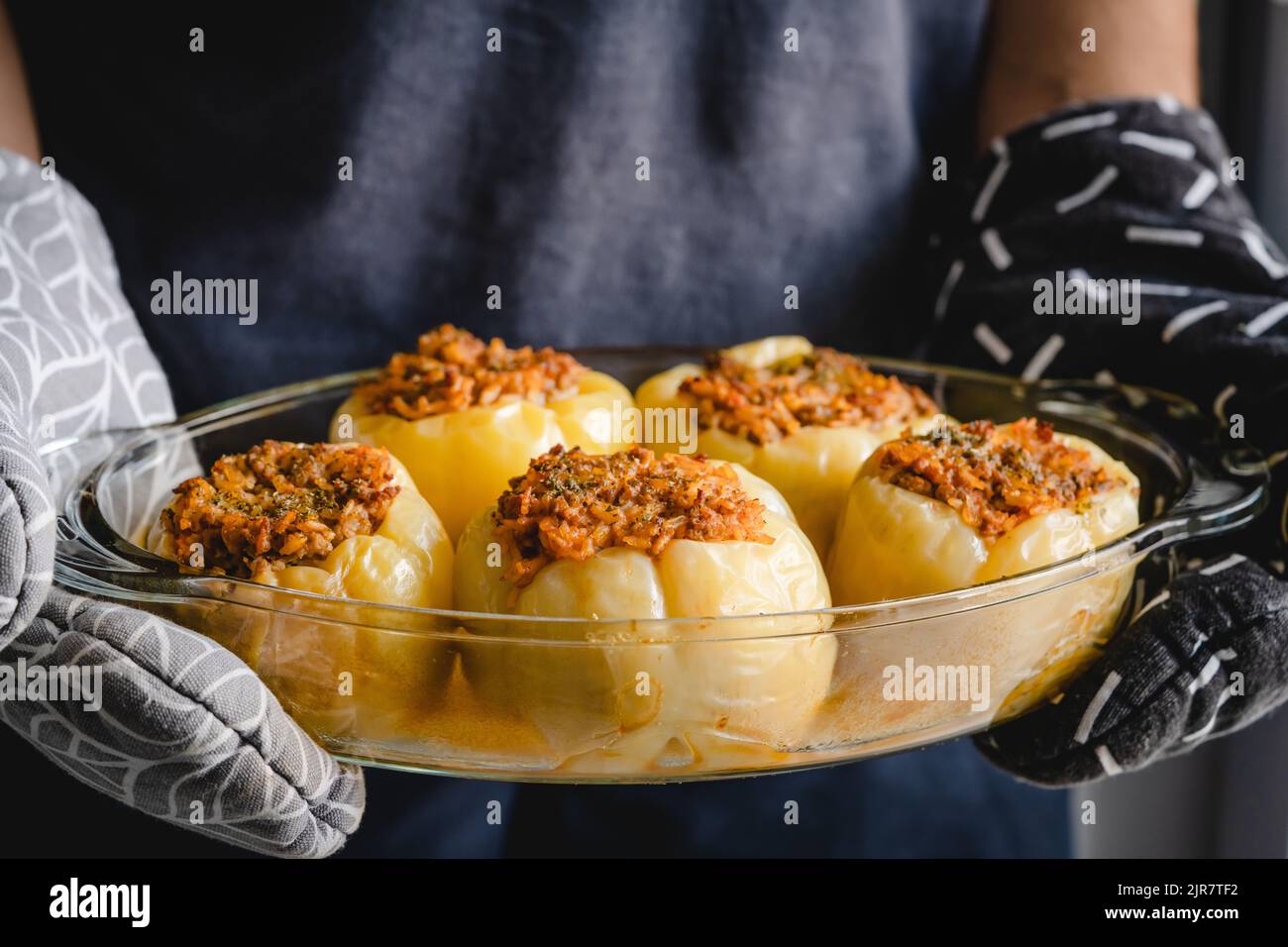 Unknown man hands hold Traditional food classic stuffed bell peepers ...