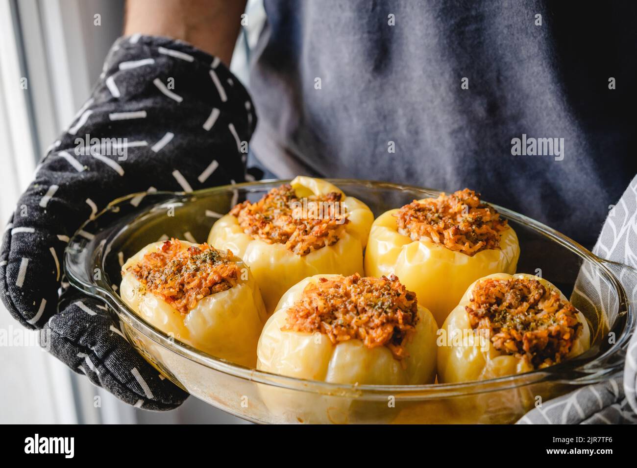 Unknown man hands hold Traditional food classic stuffed bell peepers ...