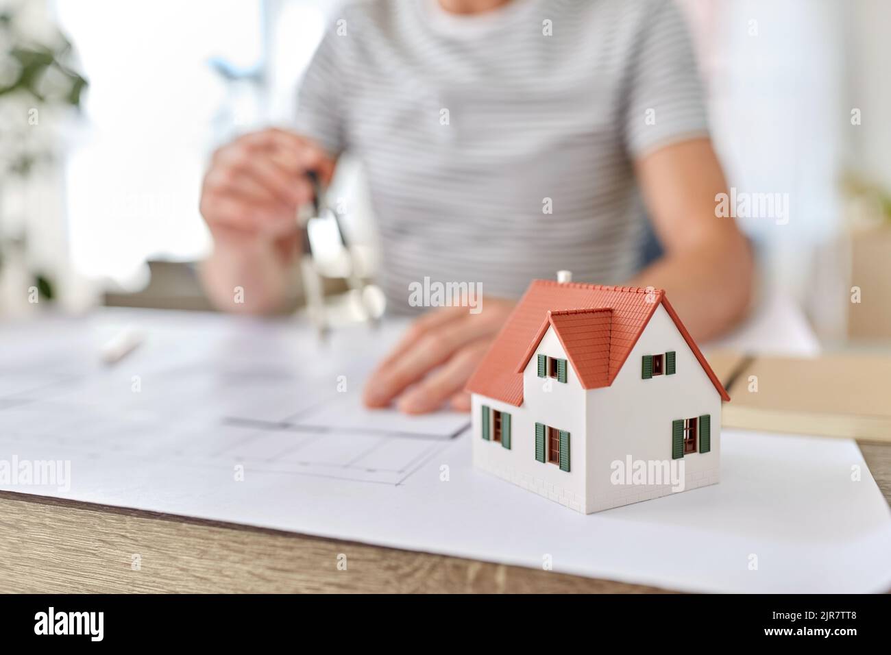 architect with blueprint working at home office Stock Photo - Alamy