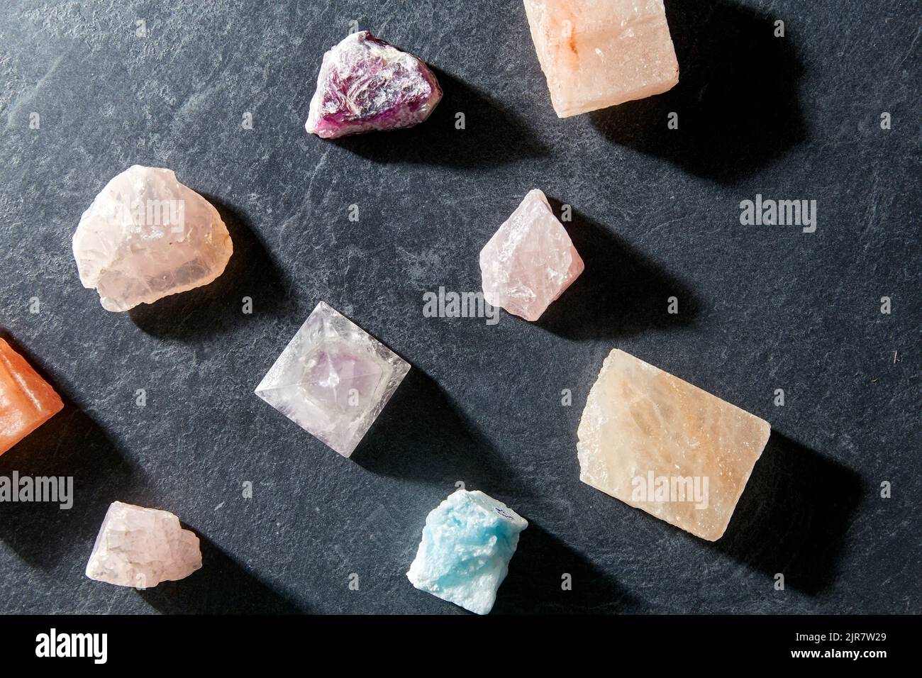 quartz crystal pyramid and gem stones on slate Stock Photo - Alamy