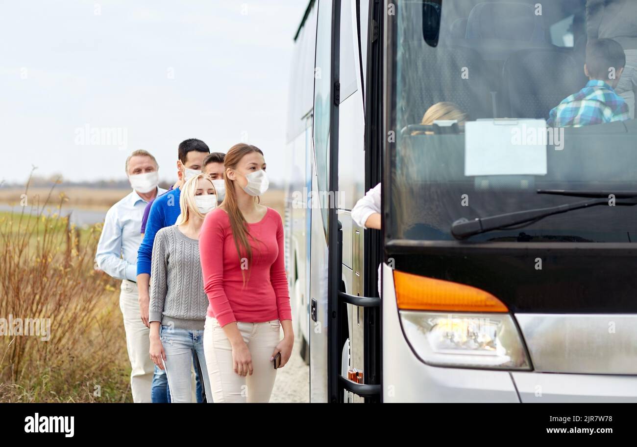 group of passengers in masks boarding travel bus Stock Photo - Alamy