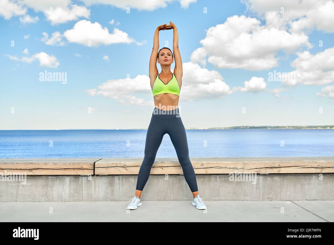 young woman doing sports on sea promenade Stock Photo - Alamy