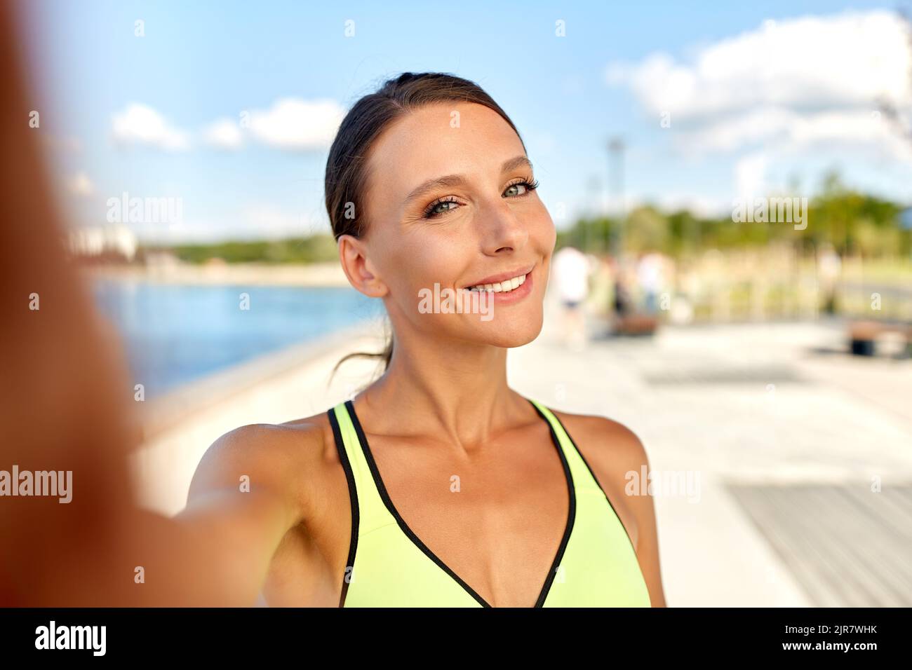 Portrait of smiling woman at the waterfront hi-res stock photography and images - Alamy