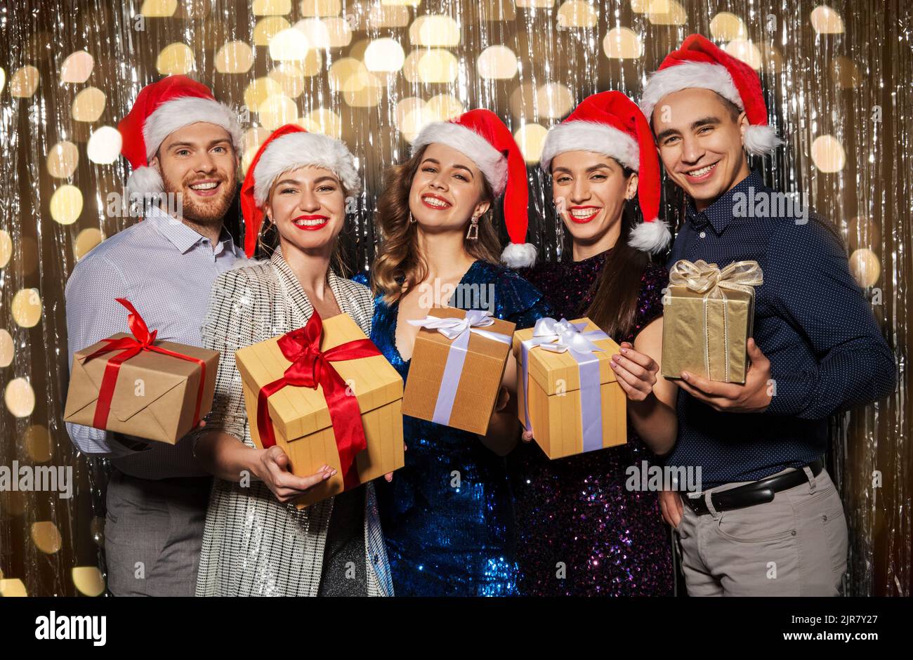 happy friends with gifts at christmas party Stock Photo - Alamy