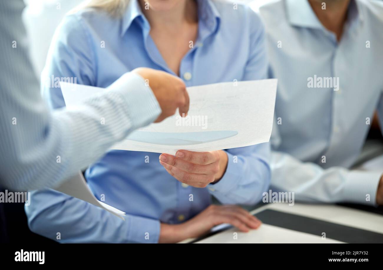 happy business team with papers meeting at office Stock Photo - Alamy