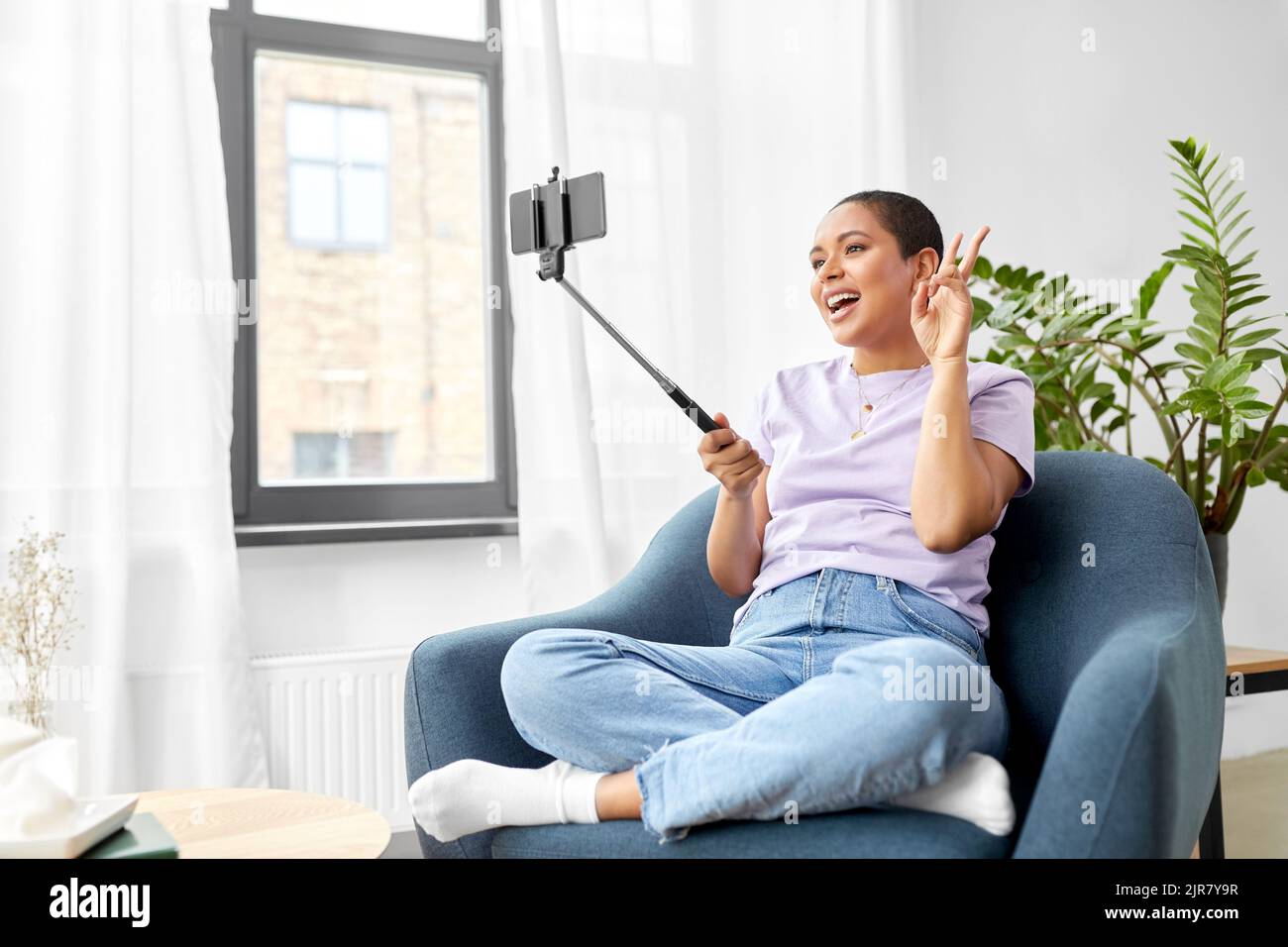 happy african american woman taking selfie at home Stock Photo - Alamy