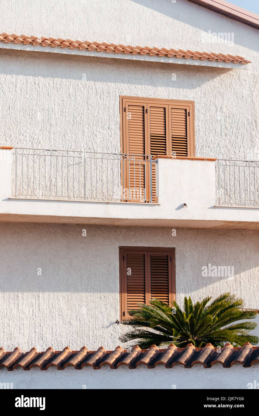 Typical white house facade part in italian city near the sea ...