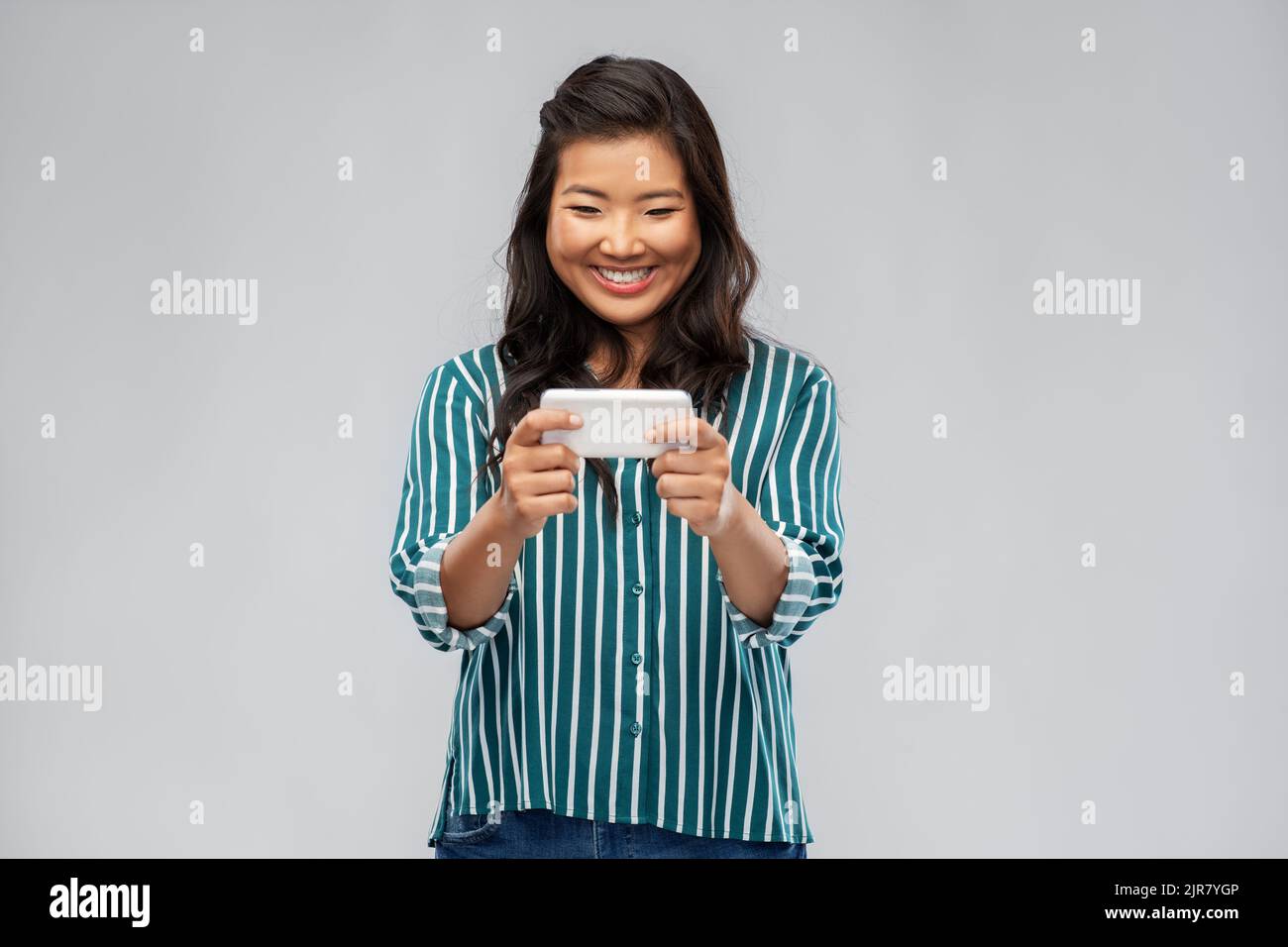 happy asian woman using smartphone Stock Photo - Alamy