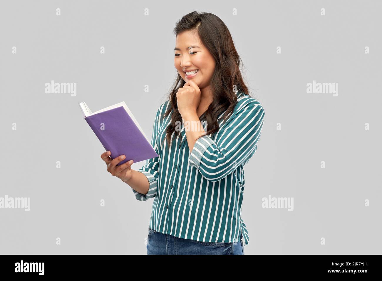 happy asian woman reading book Stock Photo - Alamy