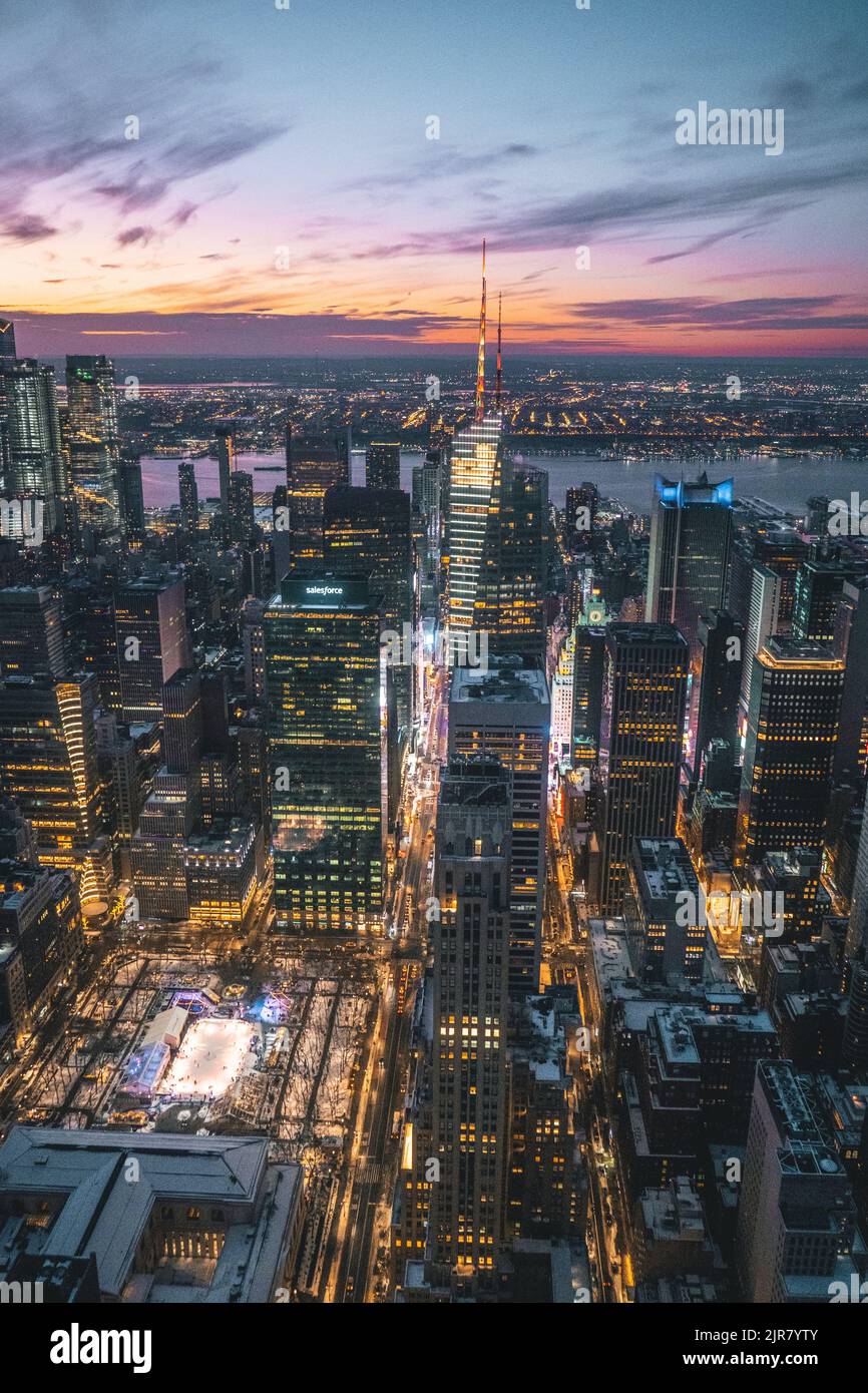 A vertical shot of The amazing New York skyline at sunset with the ...