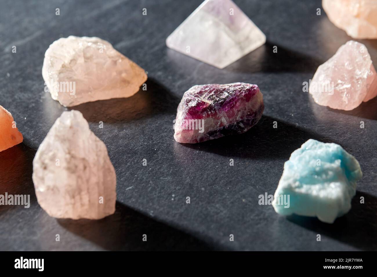 quartz crystals and gem stones on slate background Stock Photo - Alamy